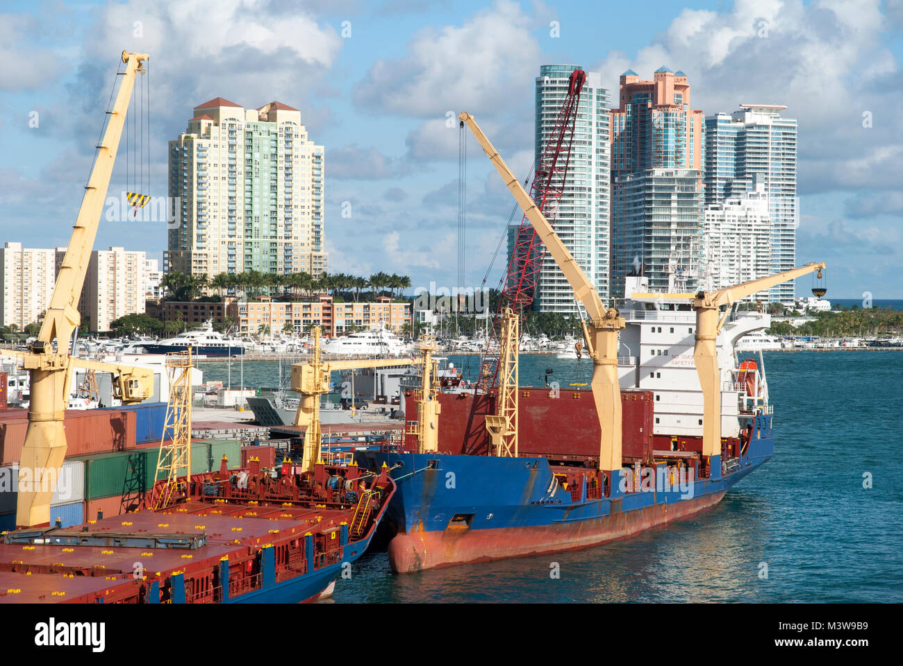 The view of cargo ships with Miami Beach skyline in a background ...