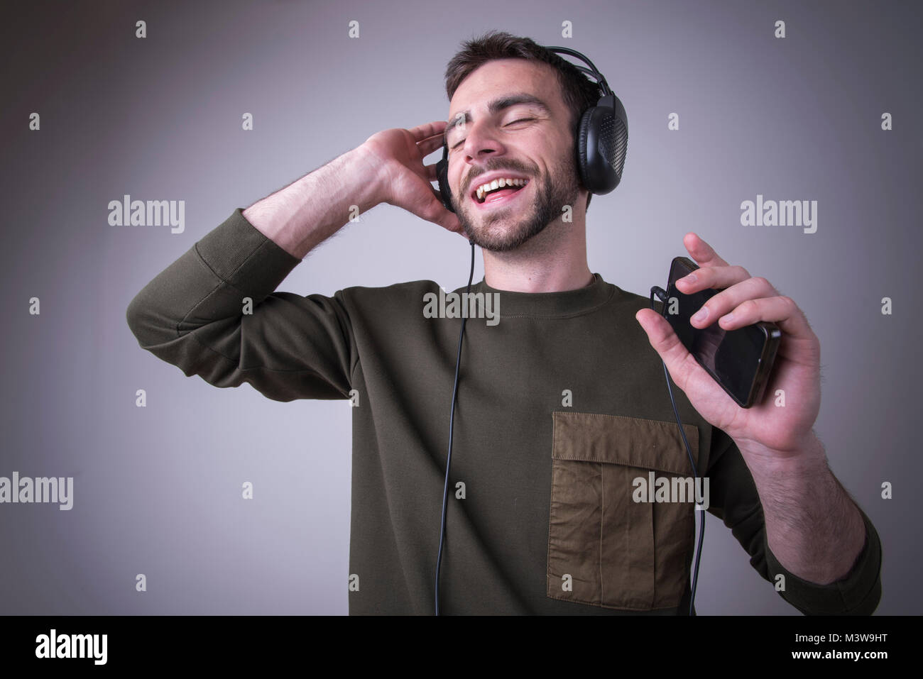 Enjoying favorite music attractive hi-res stock photography and images ...