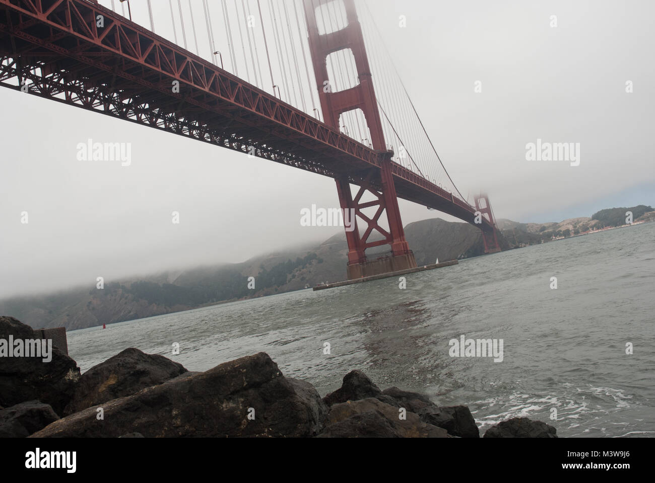 A photo taken from below the Golden Gate bridge in San Francisco on a ...