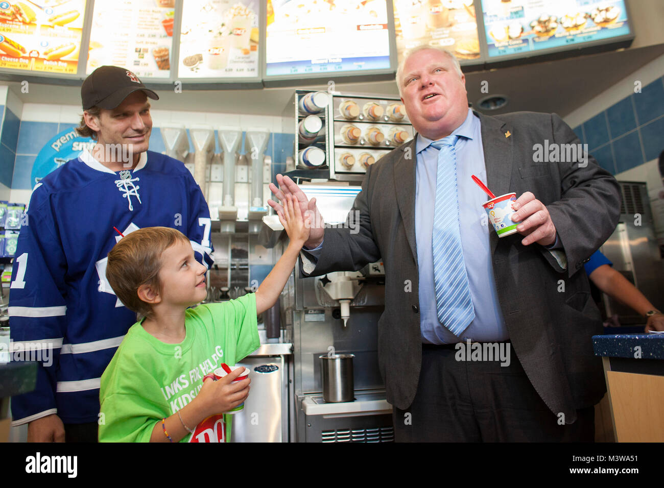 (L-R) Toronto Maple Leafs forward David Clarkson watches as SickKids ...