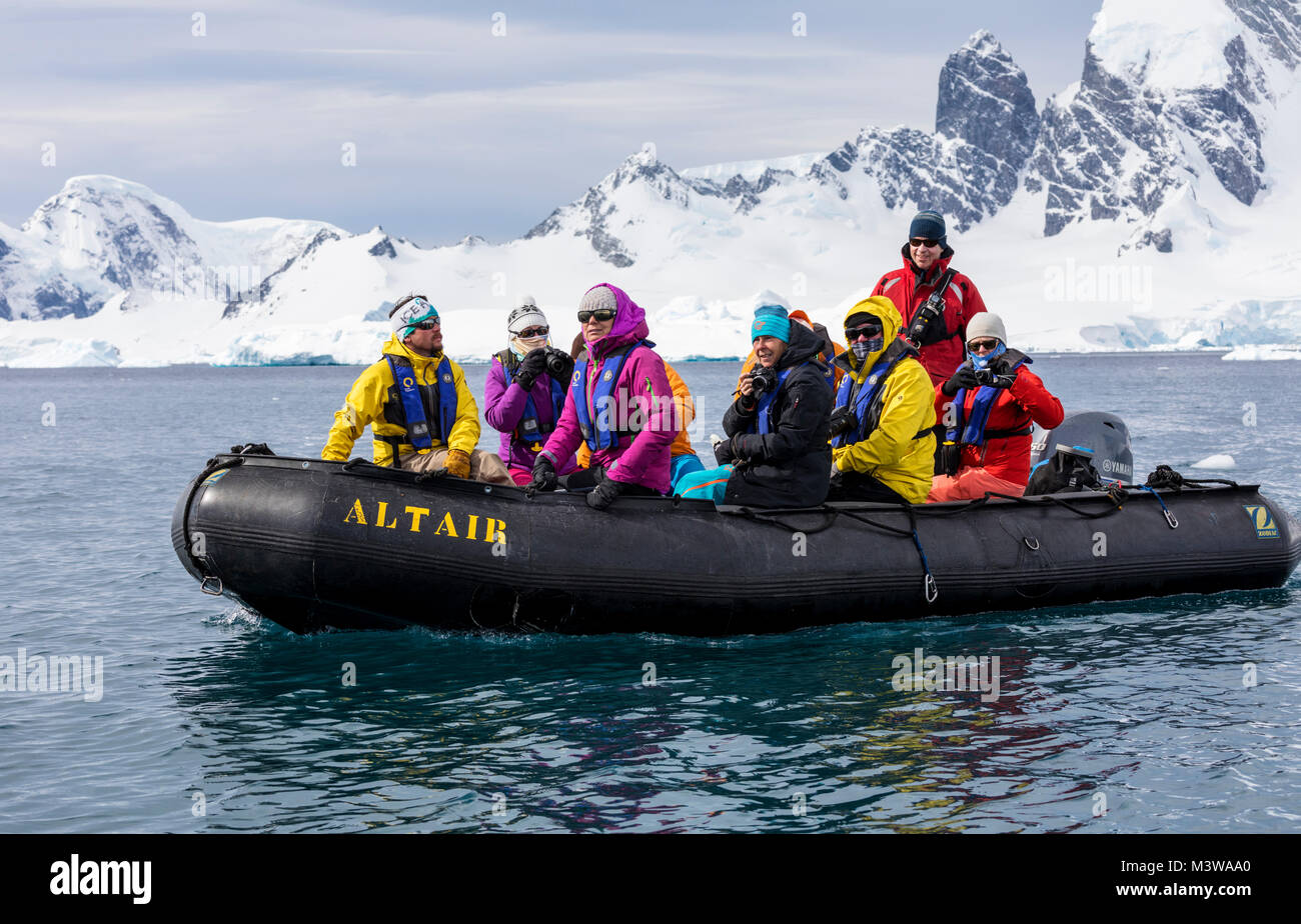 Large inflatable Zodiac boats shuttle alpine mountaineering skiers to ...