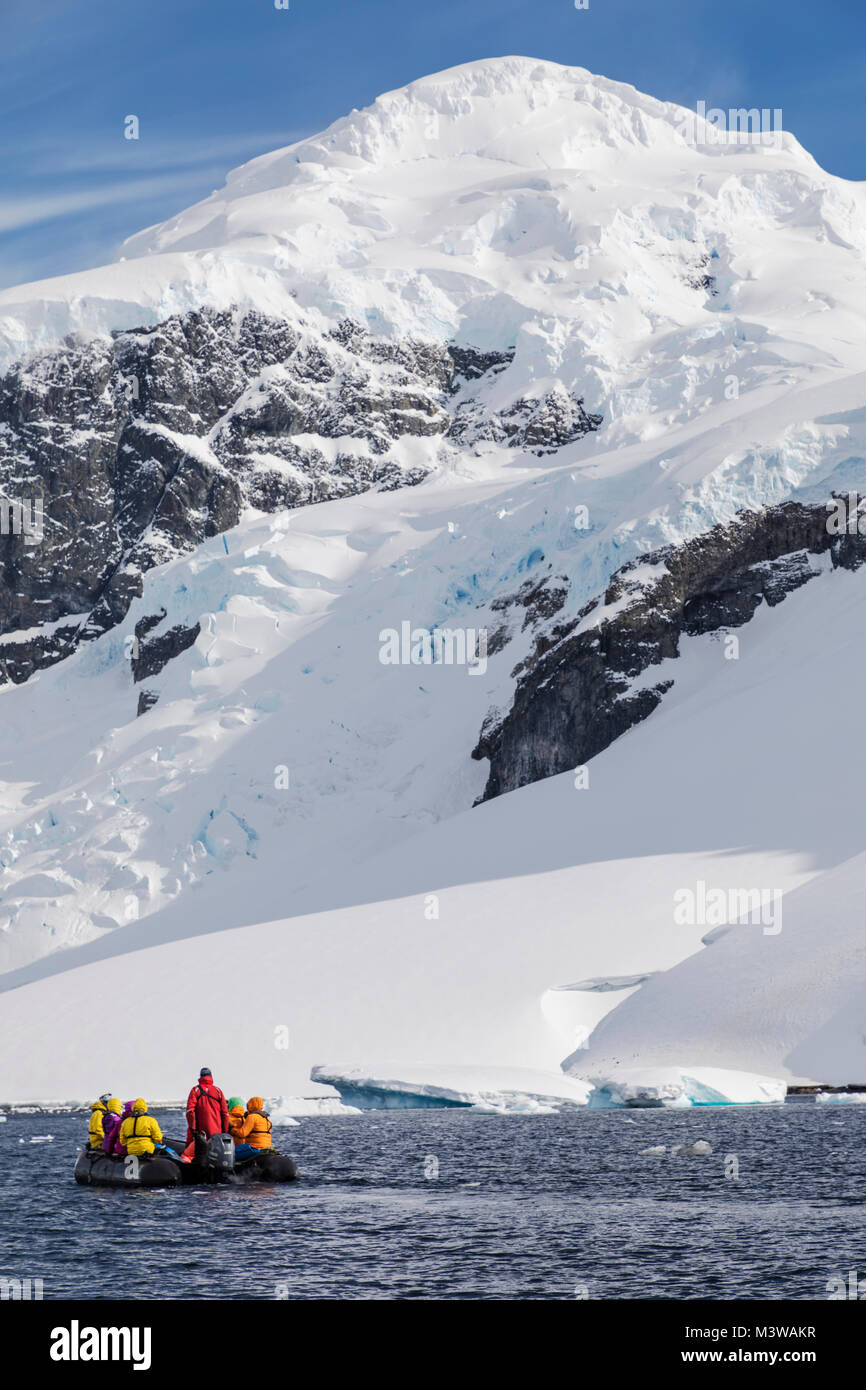 Large inflatable Zodiac boats shuttle alpine mountaineering skiers to ...