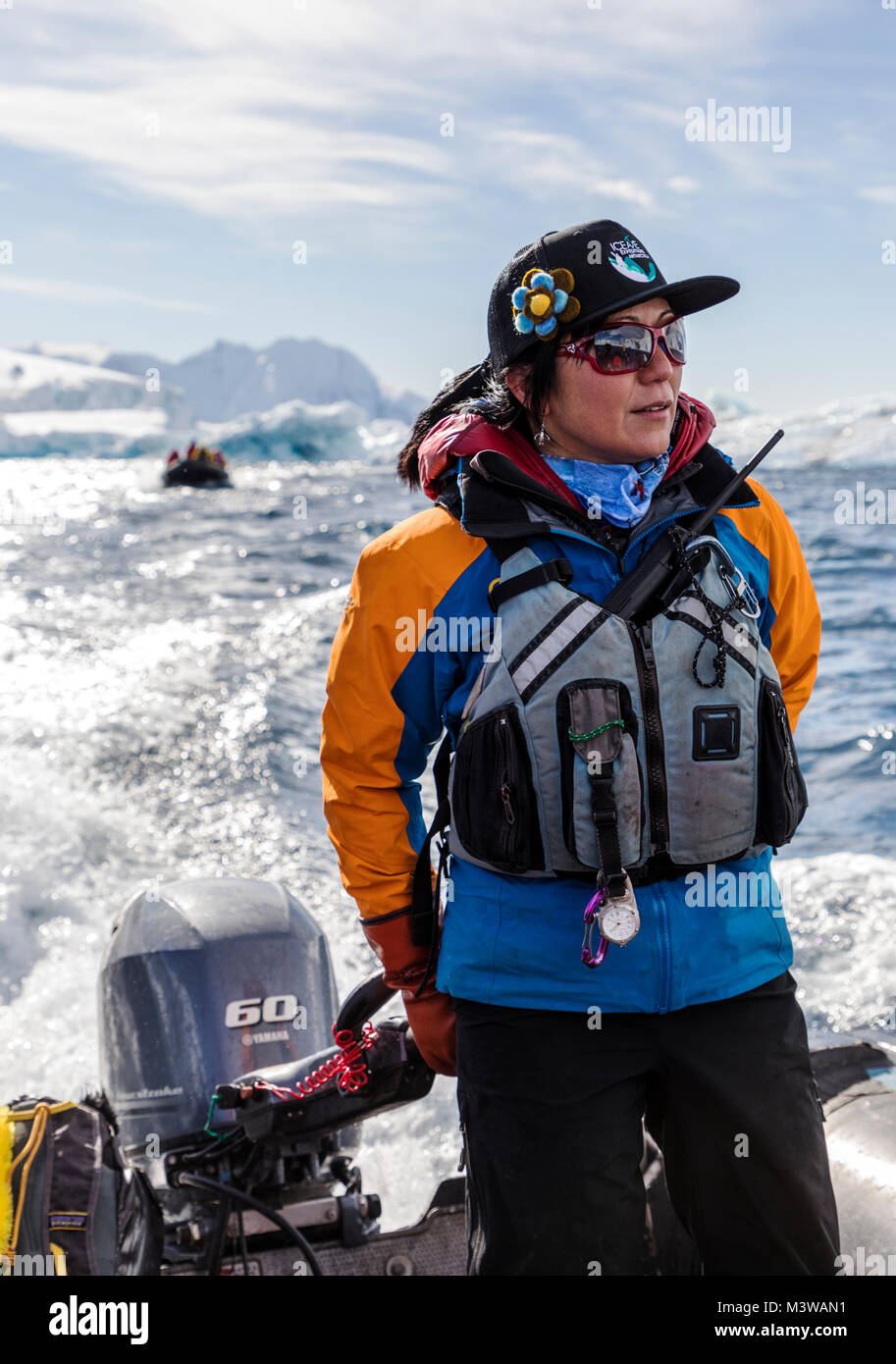 Large inflatable Zodiac boats shuttle alpine mountaineering skiers to ...