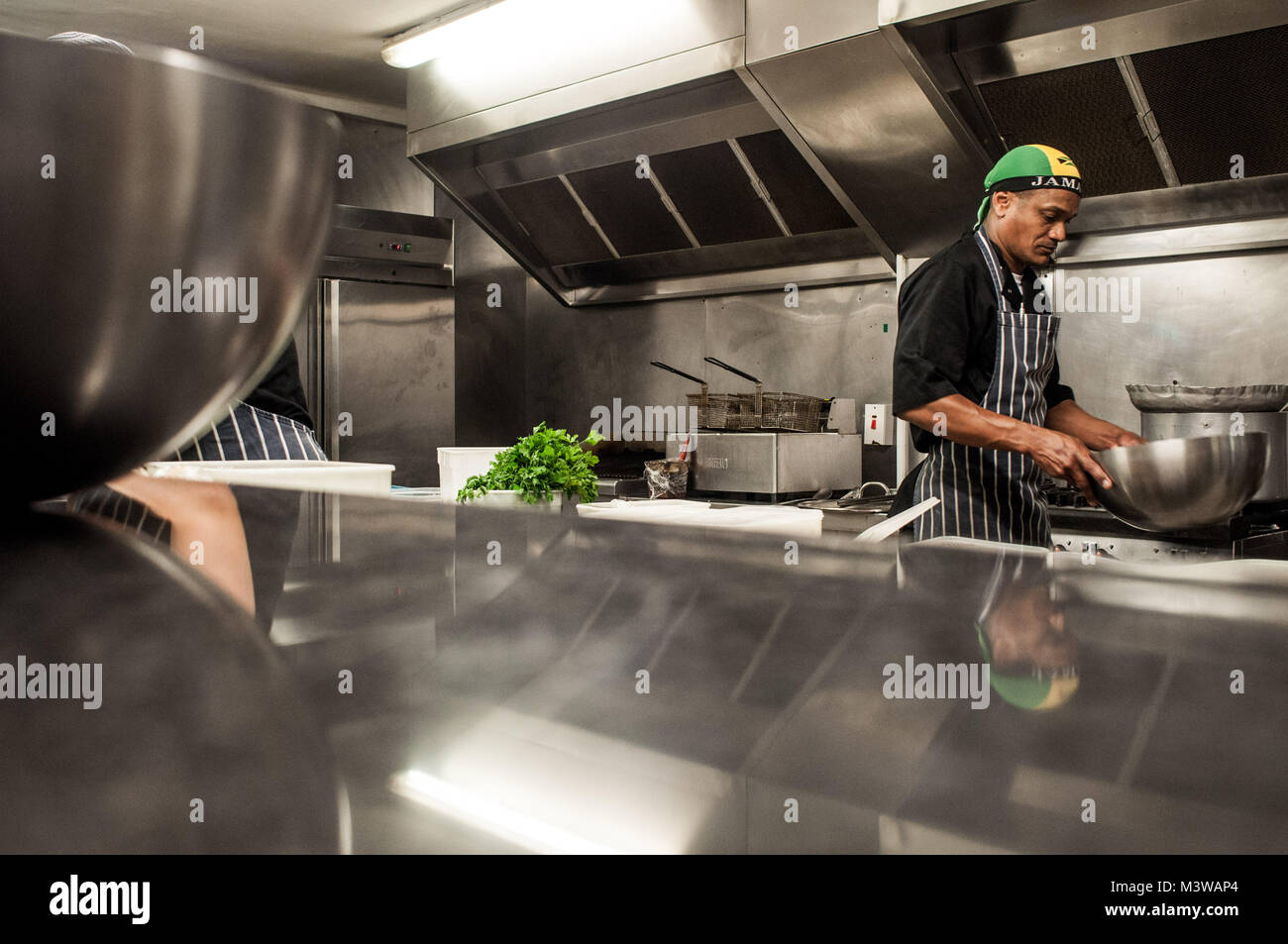 A chef working on his feet in a restaurant kitchen in Bristol, England ...