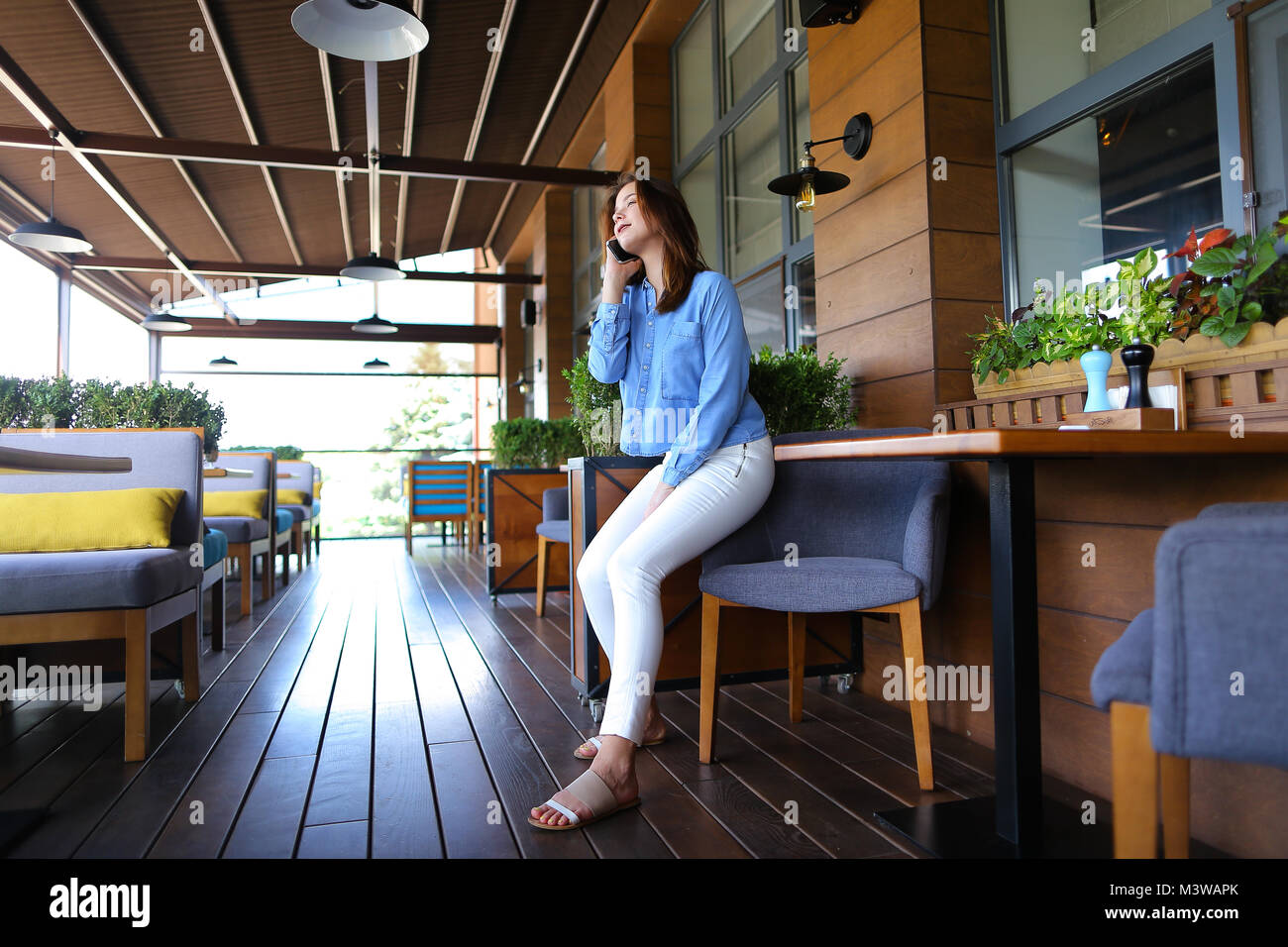 Beautiful female model speaking with photographer by smartphone Stock ...