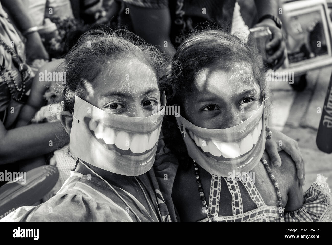 Two young girls posing with smile masks during the Barranquilla ...