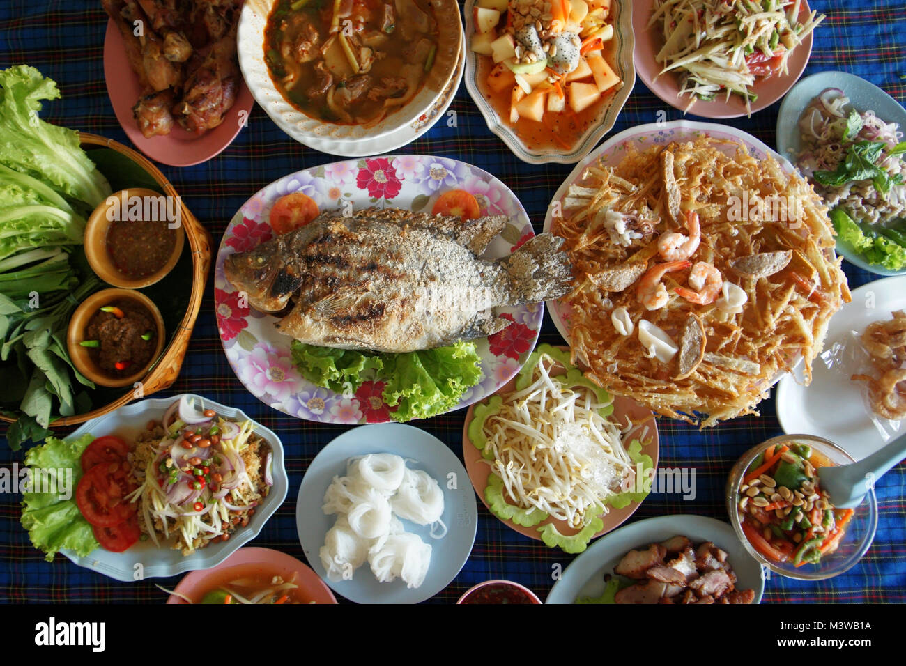 many kind of thai food on dining table for dinner, salt grilled fish ...