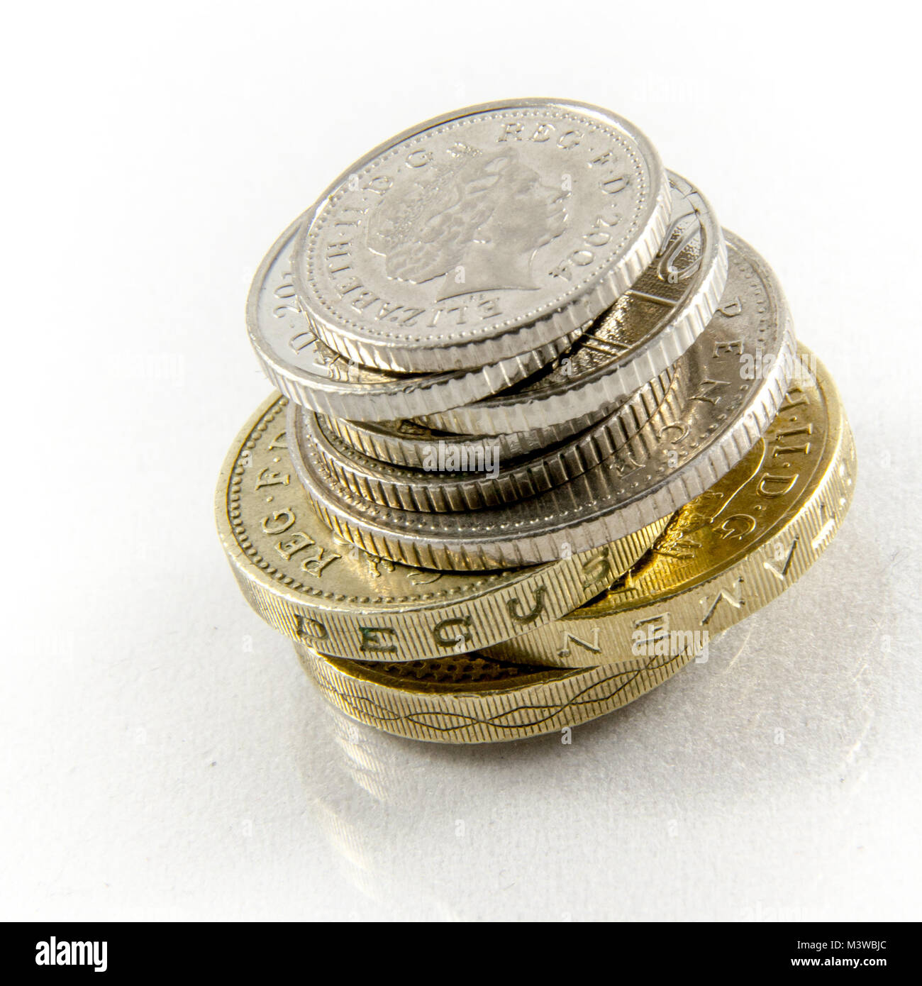 One Pound Sterling Coins Isolated on White - Money Concept Stock Photo ...