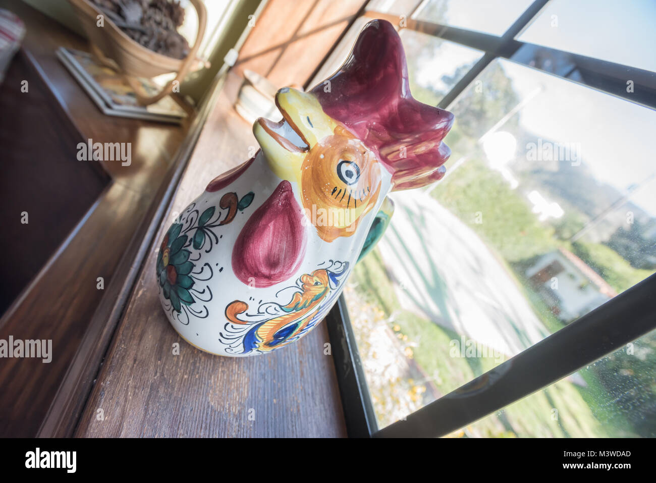 Kitschy, goofy, glazed pottery rooster shot with wide angle lens Stock ...