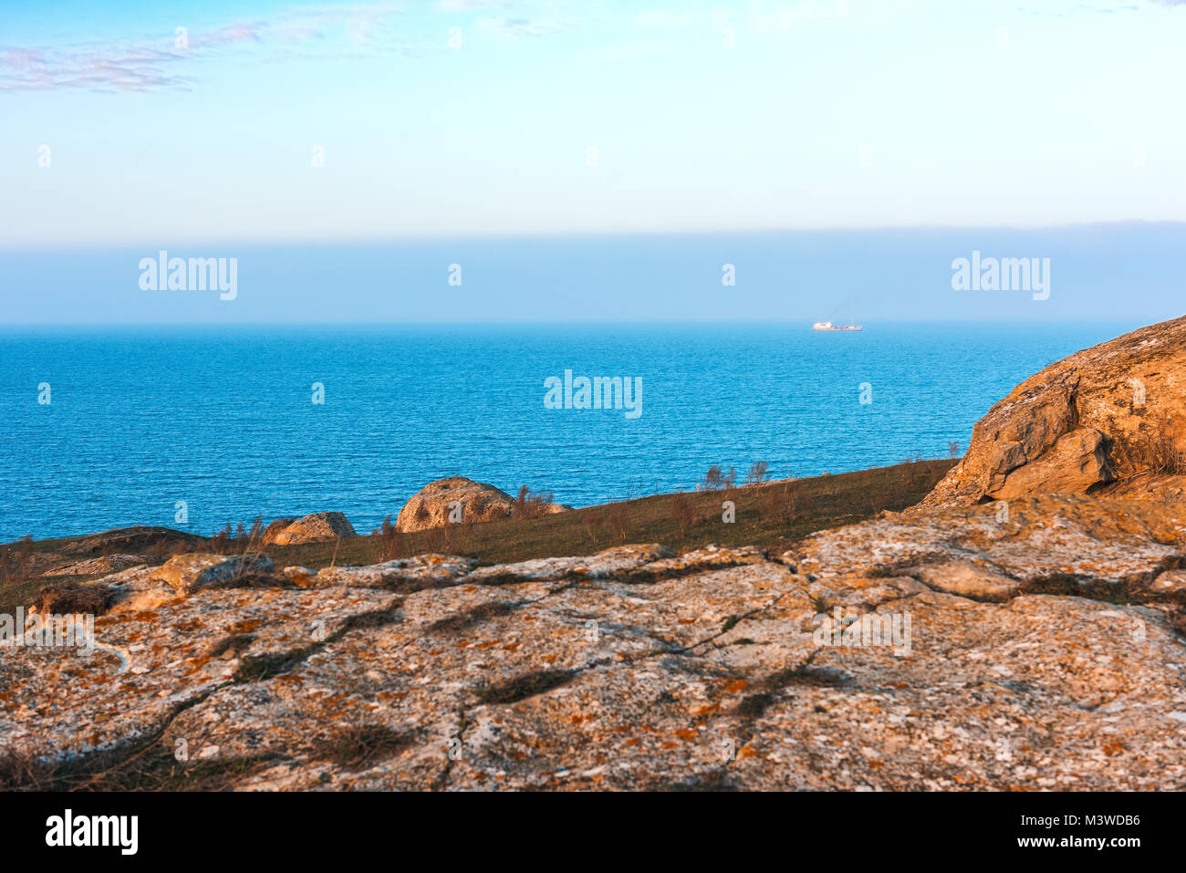 Sea coast with azure water Stock Photo - Alamy