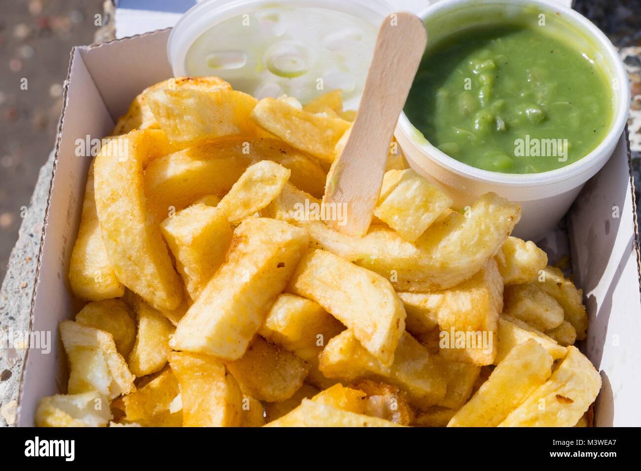 A tray of chips and mushy peas Stock Photo - Alamy