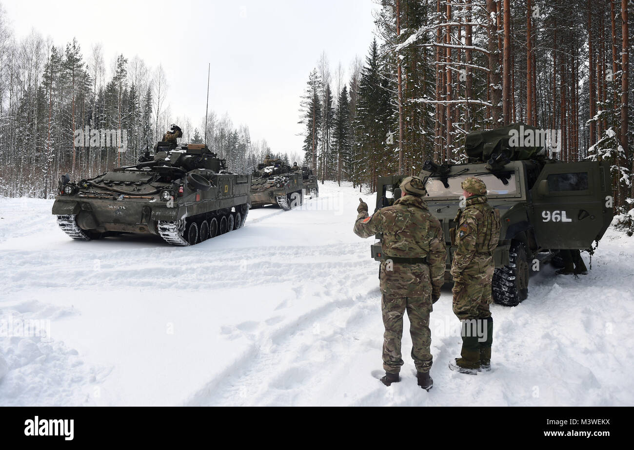 Warrior tracked armoured vehicles in the snow at a training area near ...