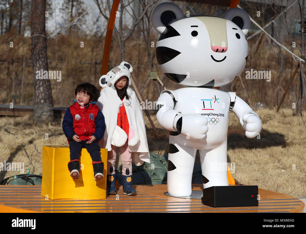 Children pose with the Olympic Games mascot in the Olympic Park during ...