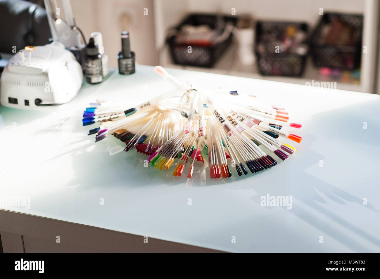 Variety of nail color testers in nail salon Stock Photo - Alamy