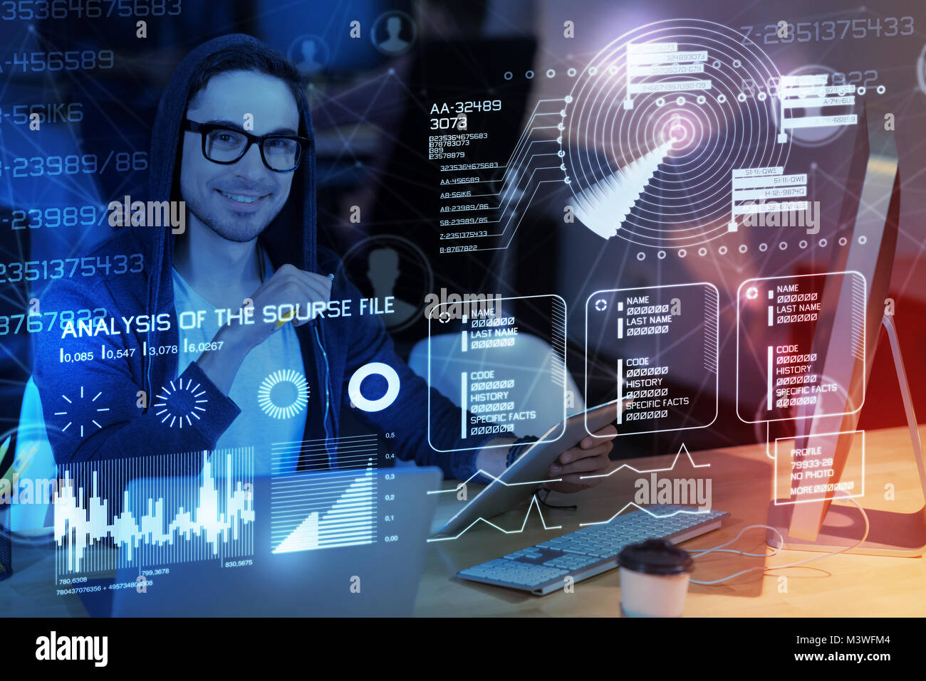 Positive programmer providing security at night Stock Photo - Alamy