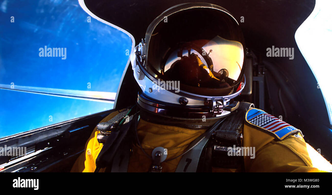 A U-2 pilot looks outside while flying the aircraft. U-2 pilots wear ...