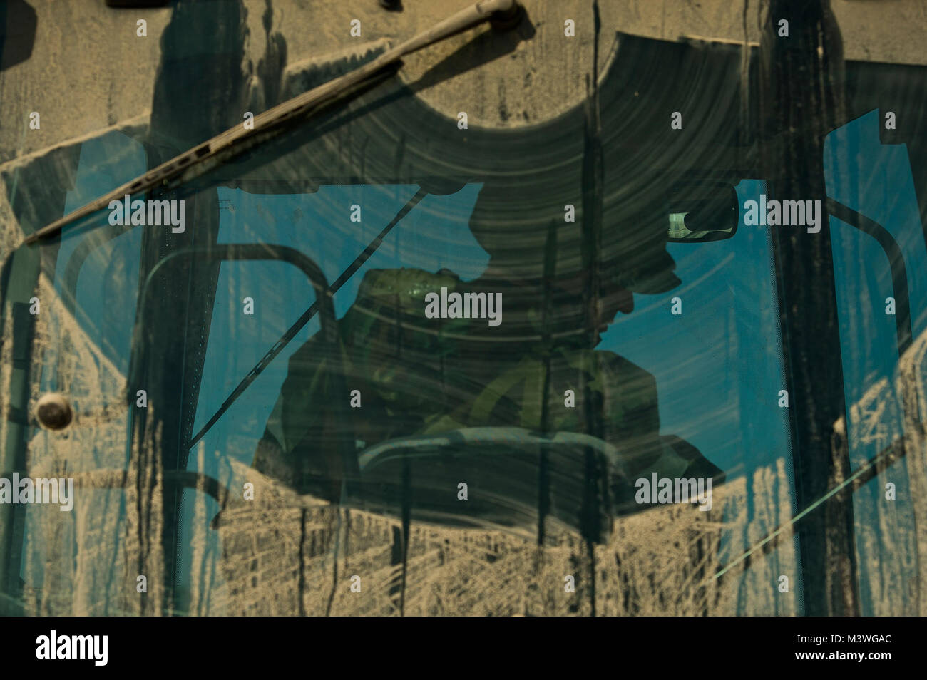 Tech. Sgt. Bradley Garman operates a dust sweeper while repairing ...