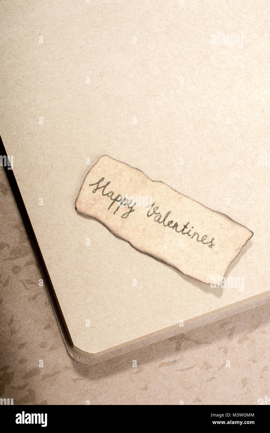 Valentine's day wording on torn paper as Love concept Stock Photo - Alamy