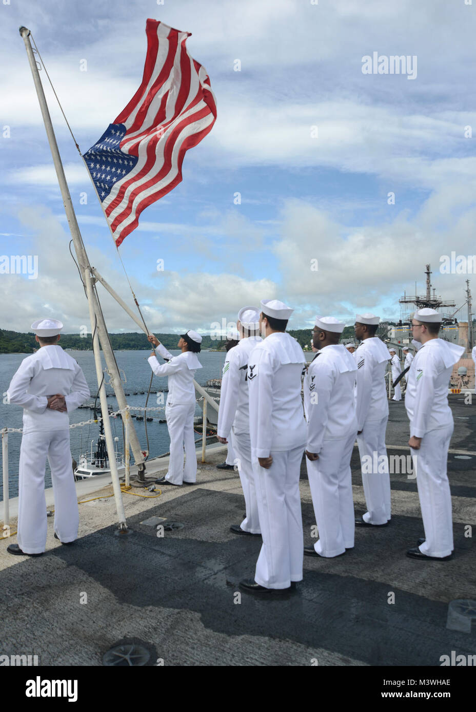 NAVAL BASE KITSAP-BREMERTON (June 1, 2017) Sailors lower the ensign ...
