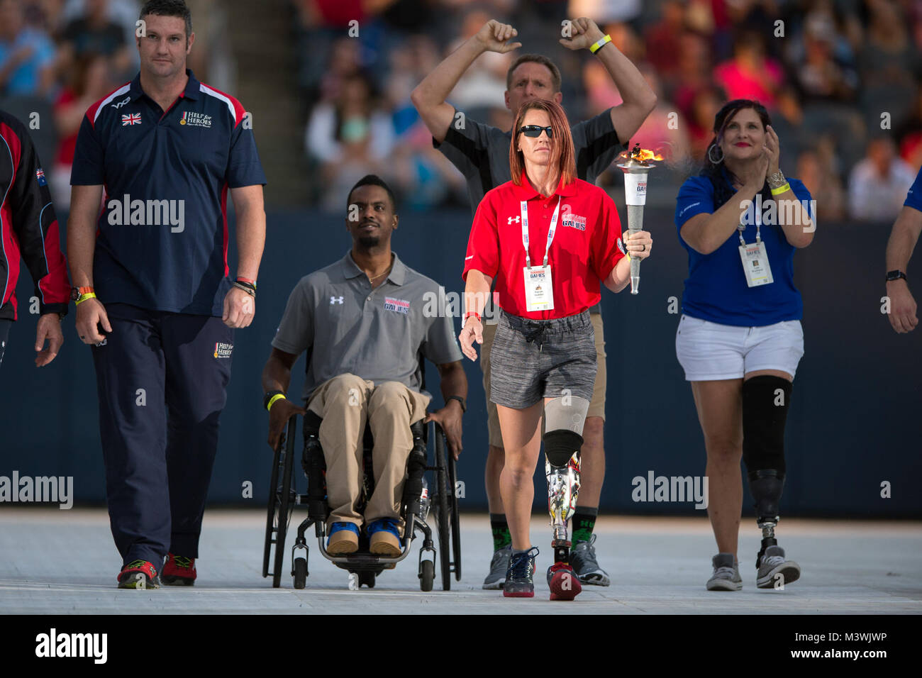 Marine Corps veteran Sarah Rudder carries the 2017 Department of ...