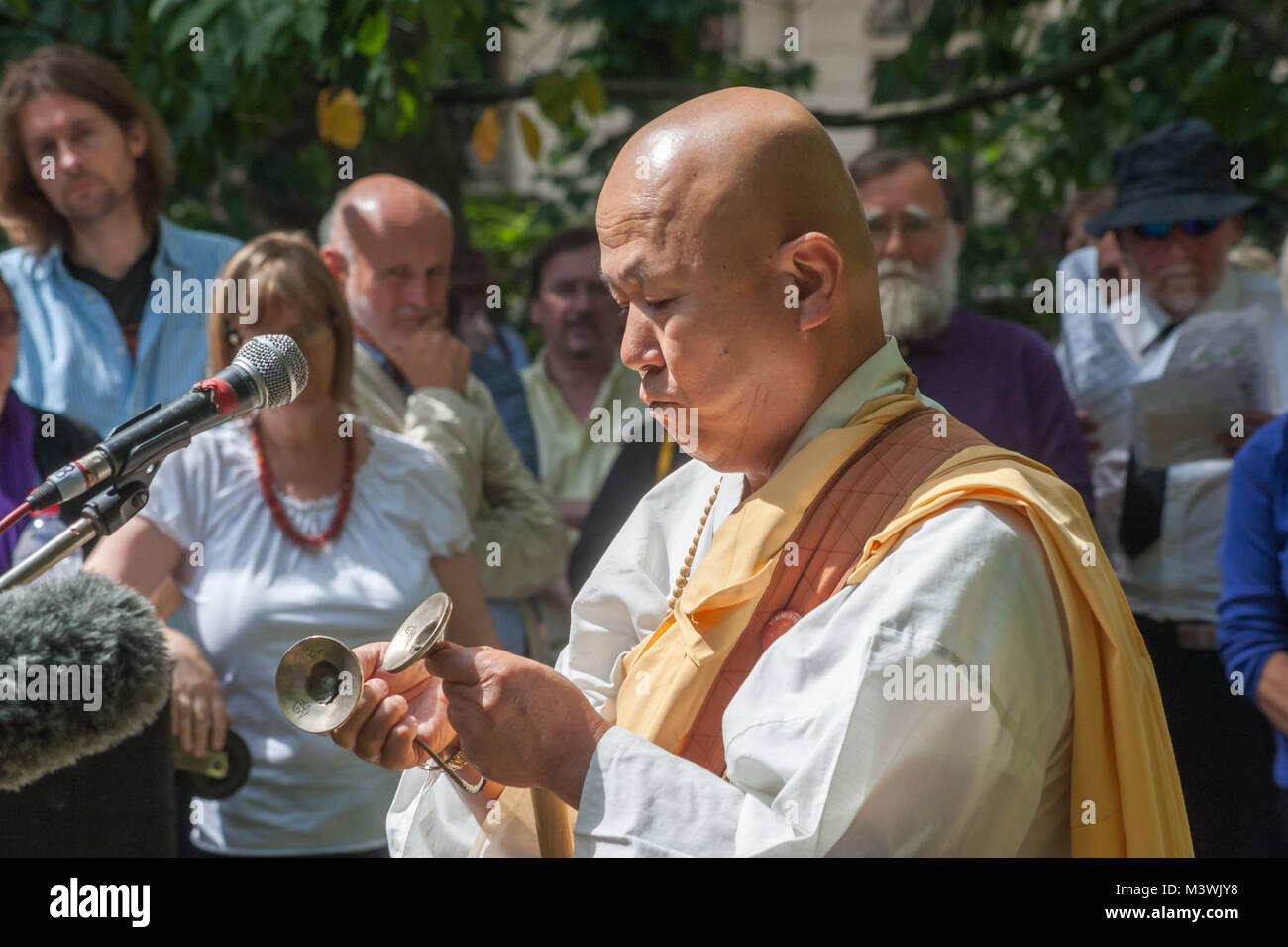 Rev. S. Nagase, Buddhist monk at Battersea Peace Pagoda rings bells ...
