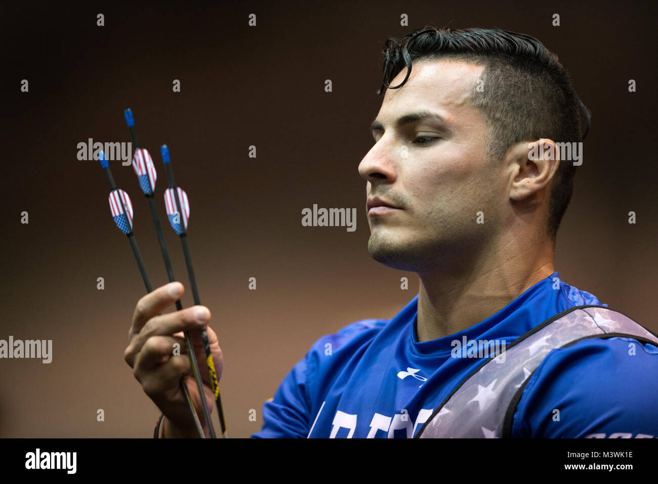 Air Force Staff Sgt. Vincent Cavazos inspects his arrows after making ...