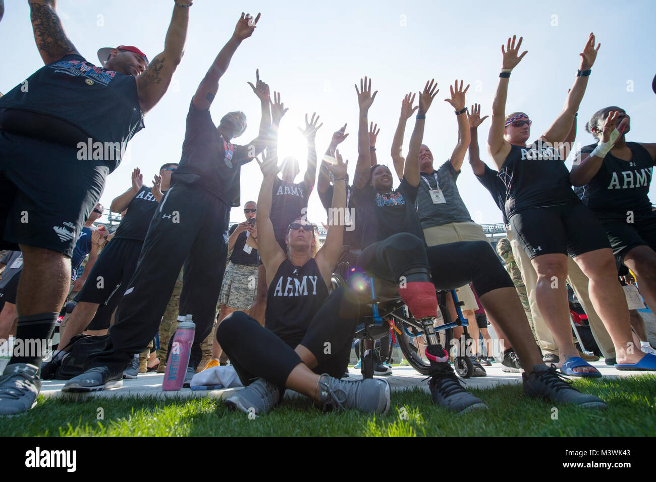 Team Army gestures a good luck vibe to teammate Air Force Tech Sgt ...
