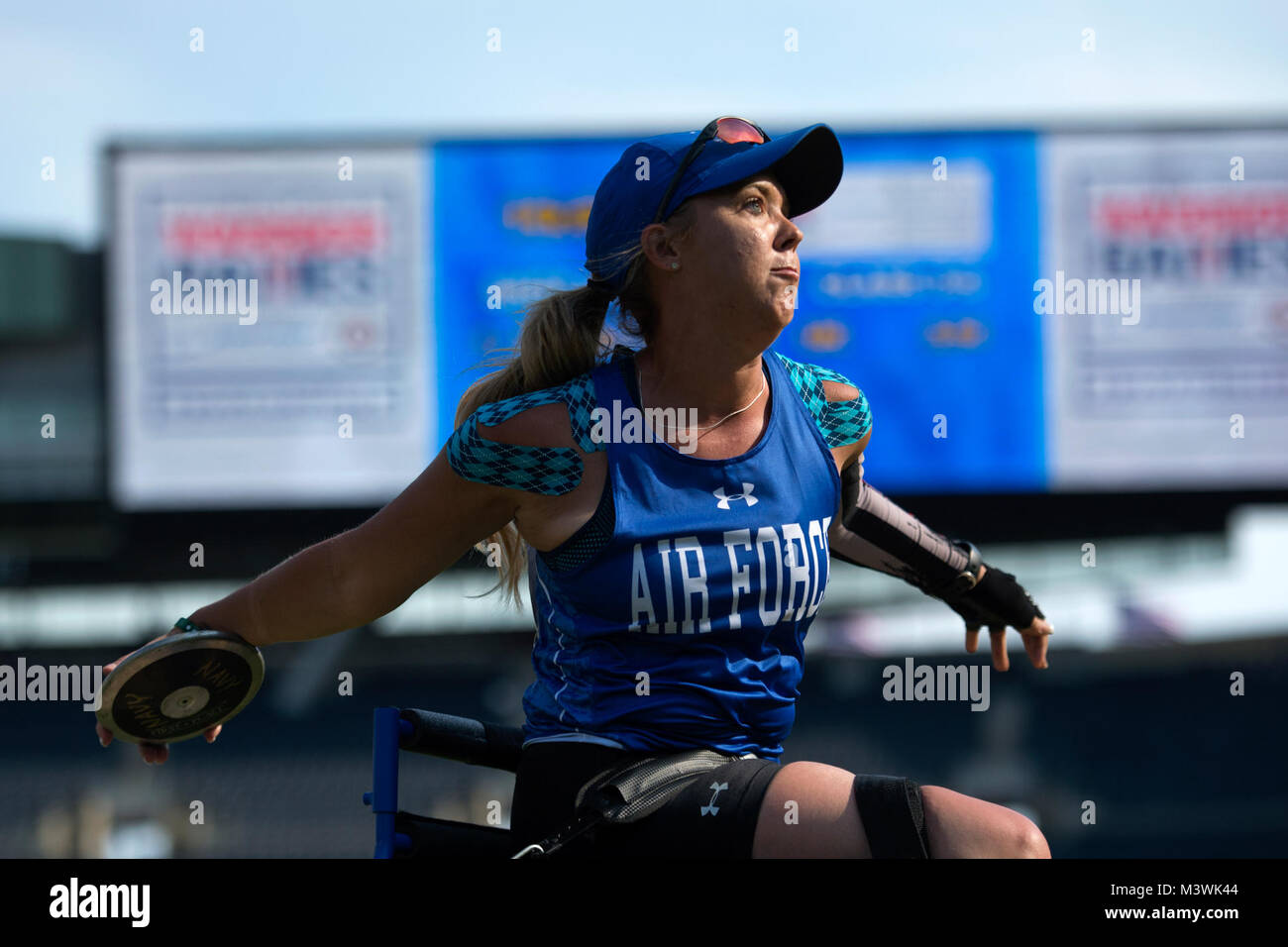Air Force veteran Senior Airman Heather Carter throws shot put at ...