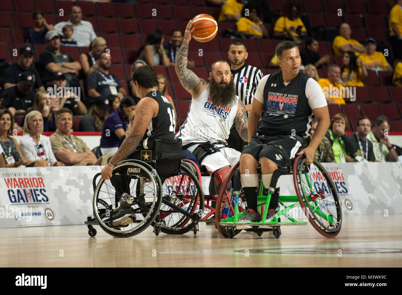 Navy veteran Seaman Steven Davis maneuvers between a pair of Army ...
