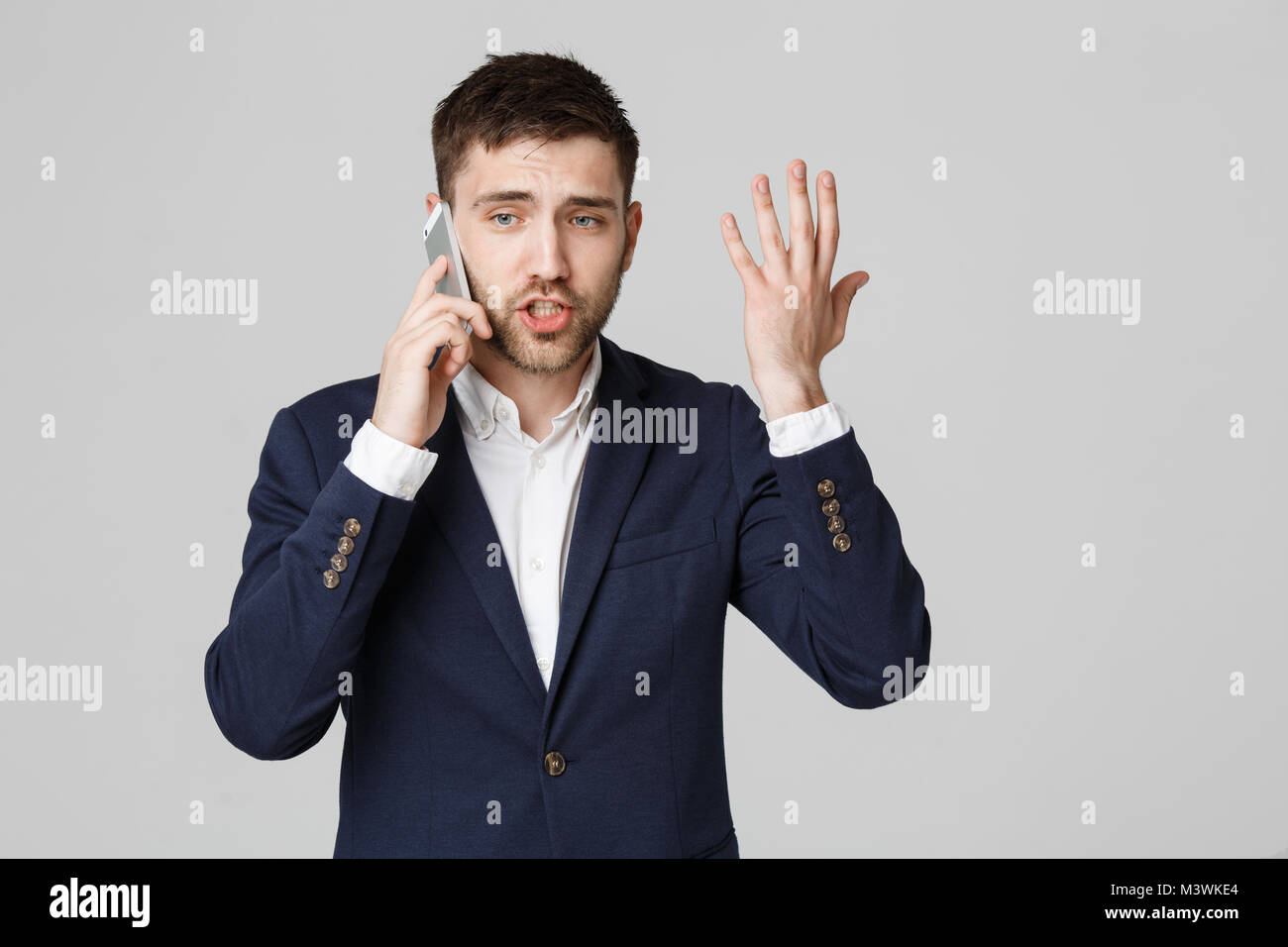 Business Concept - Portrait young handsome angry business man in suit ...