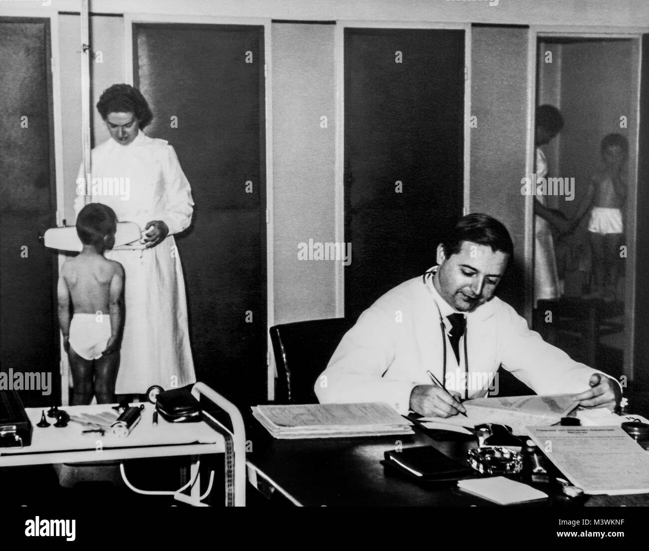 Old black and white archival photograph showing doctor and nurse ...
