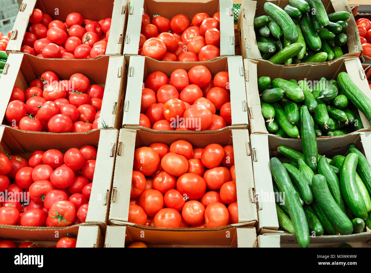 boxes with cucumbers and tomatoes in supermarket. Healthy Eating Stock ...