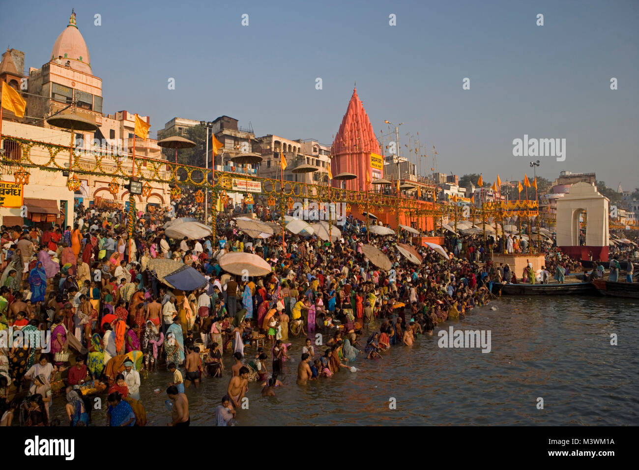 India, Varanasi, Ganga river, Ghats. Hindu pelgrims come from all over ...