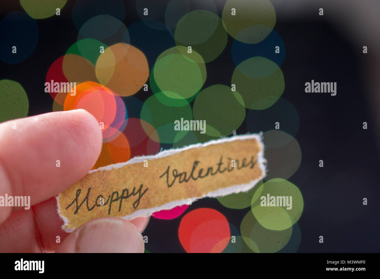 Valentine's day wording on torn paper as Love concept Stock Photo - Alamy