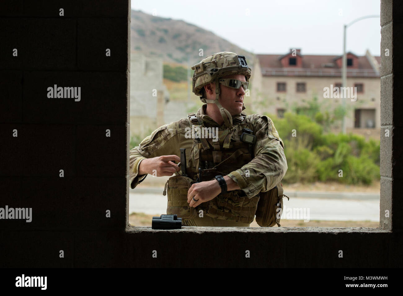 U.S. Air Force Staff Sgt. Cole Carroll prepares his gear while ...