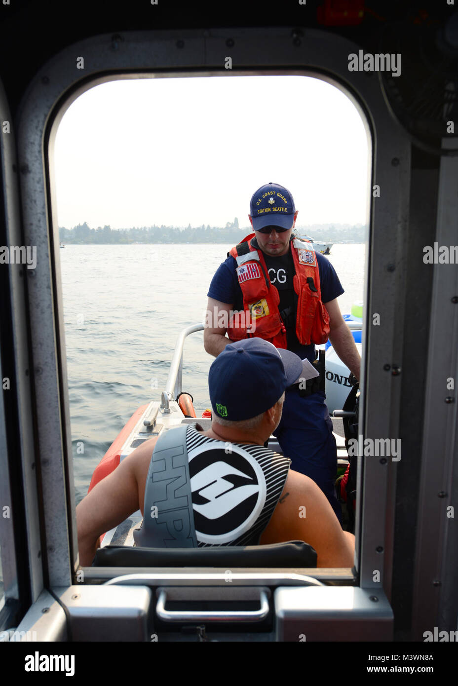 Petty Officer 1st Class Alex Meyers, a boarding officer with U.S. Coast ...