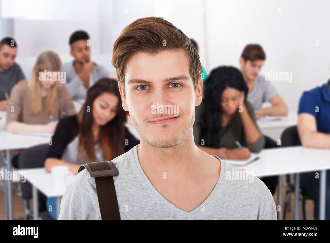 Handsome male student classroom hi-res stock photography and images - Alamy