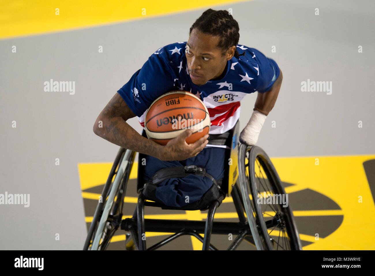 Retired Marine Corp Sgt. Anthony McDaniel protects the ball during ...