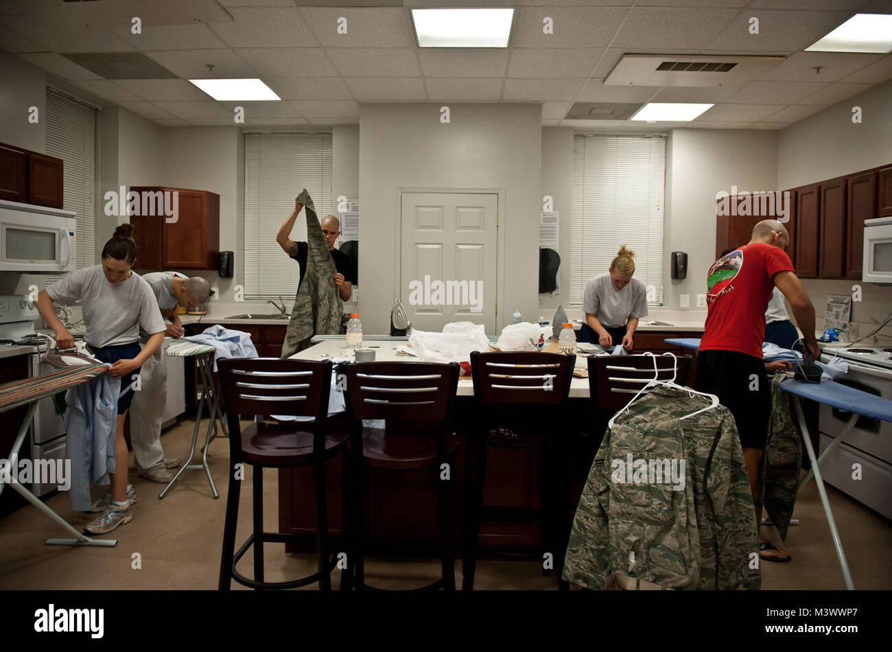 Ironing uniforms hi-res stock photography and images - Alamy