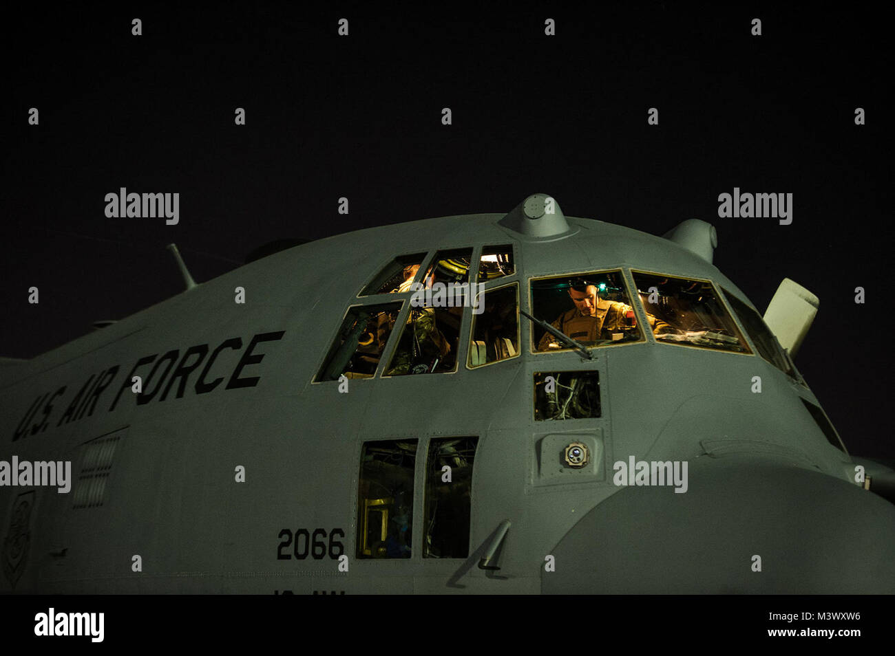 Maj. Jake Hiles prepares for the day's mission on a C-130H Hercules at ...