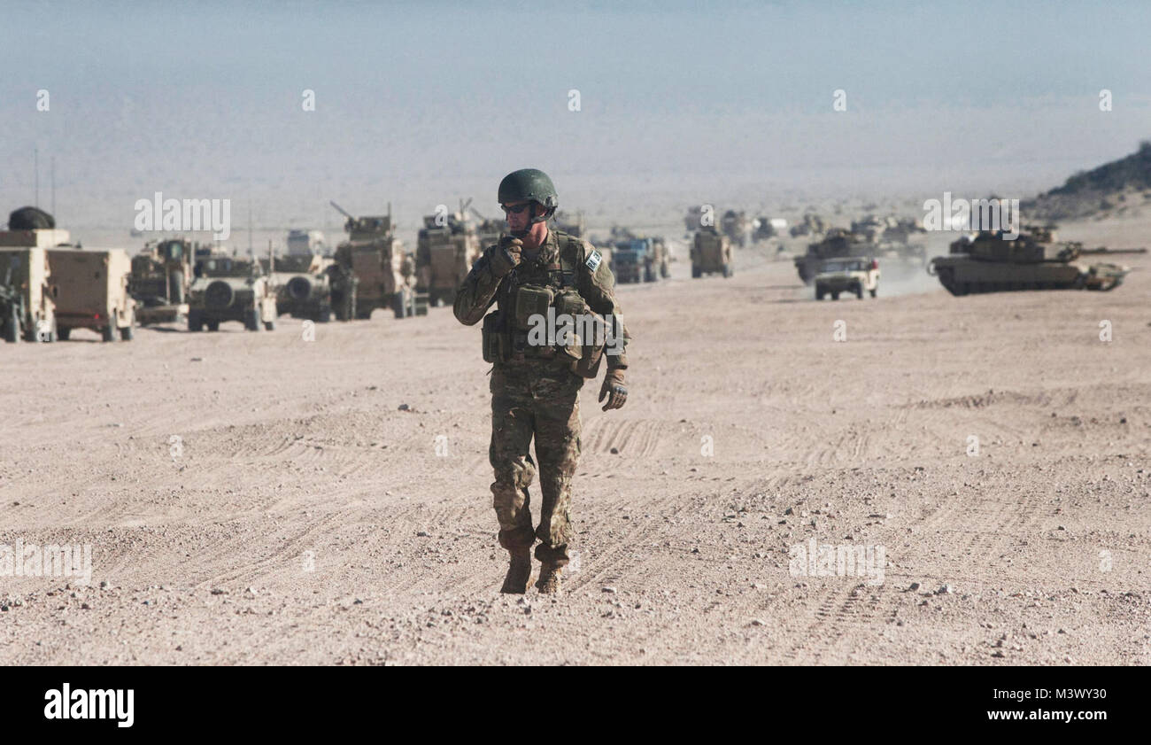 Tech. Sgt. Rick Lawson talks on his radio while walking by an Army ...