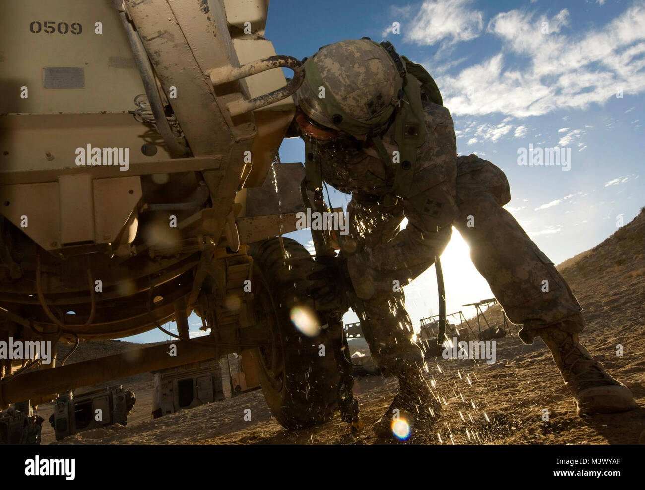 Private 1st Class Nicholas Gates, a 1st Brigade medic, drinks water ...