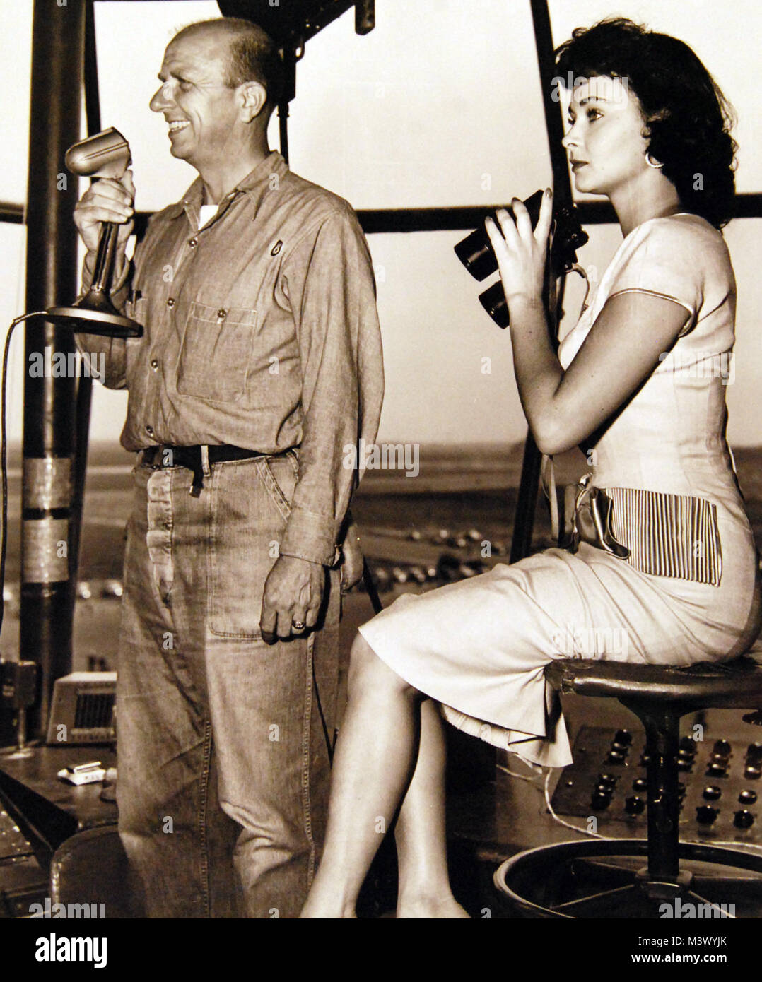 80-G-680573: Model and airplane meet at an air show at Los Alamitos ...