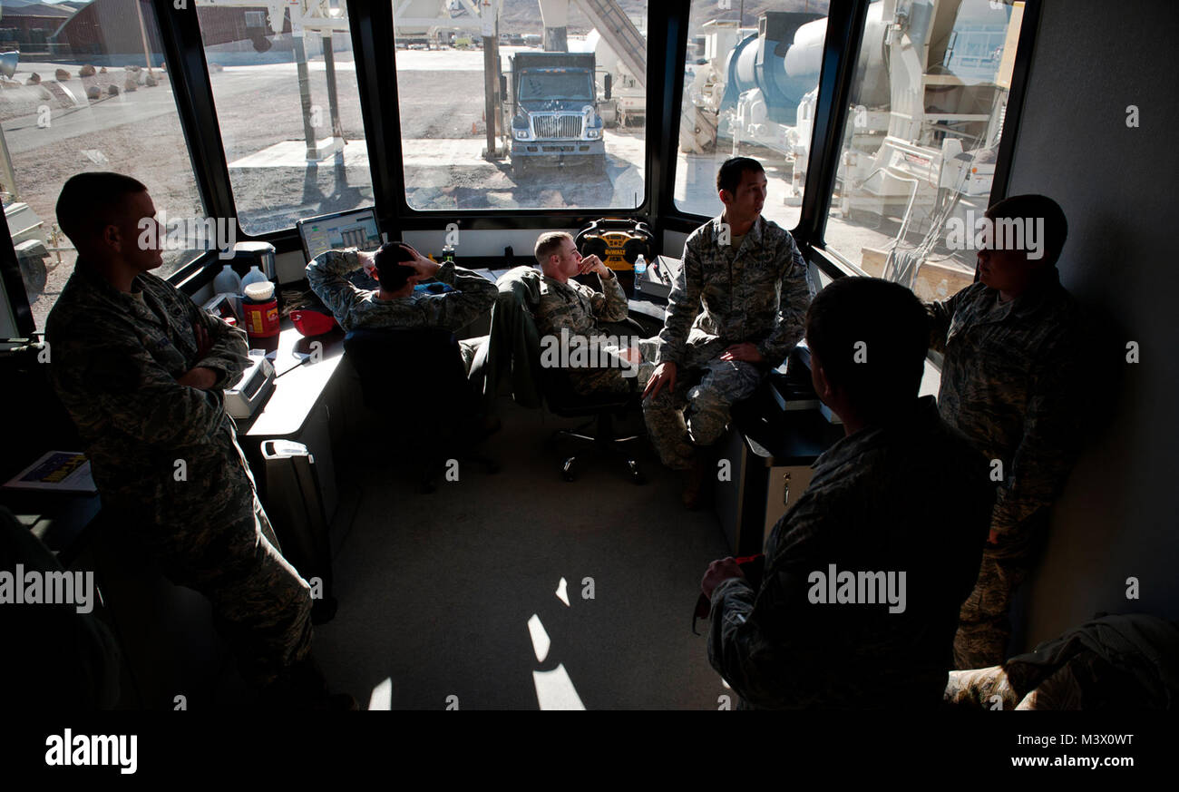 Members of the 820th RED HORSE squadron wait inside a trailer for a ...
