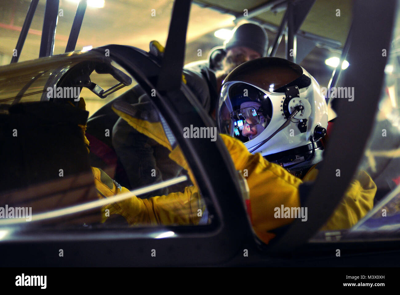 U-2 pilot Capt. Travis checks his heads up display in the cockpit of a ...