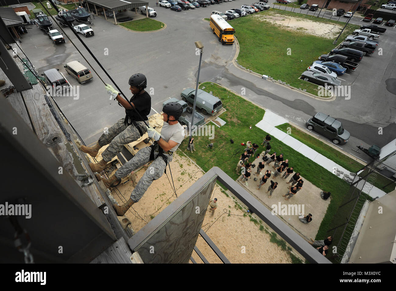 From right, retired Col. Ken Rodriguez repels down a tower with Cadet ...