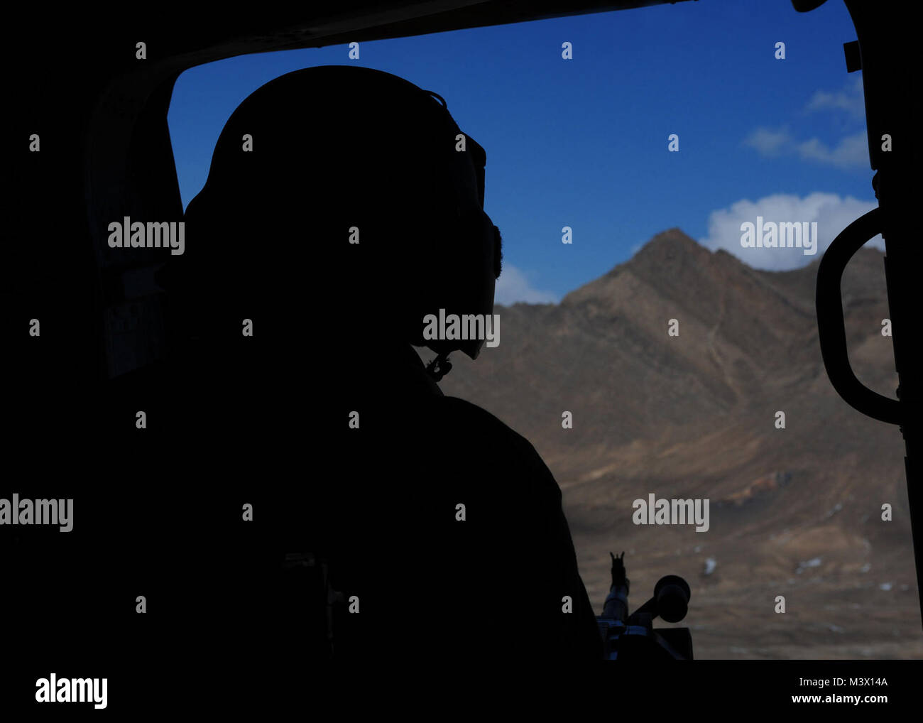 An aerial gunner with the 438th Air Expeditionary Advisory Squadron ...