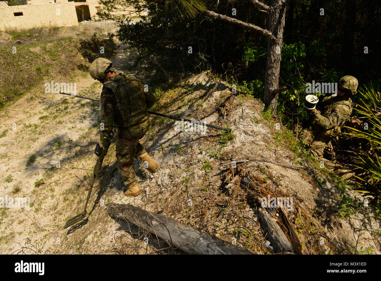 Tech. Sgt. Ryan Tennyson, explosive ordinance disposal team lead, uses ...