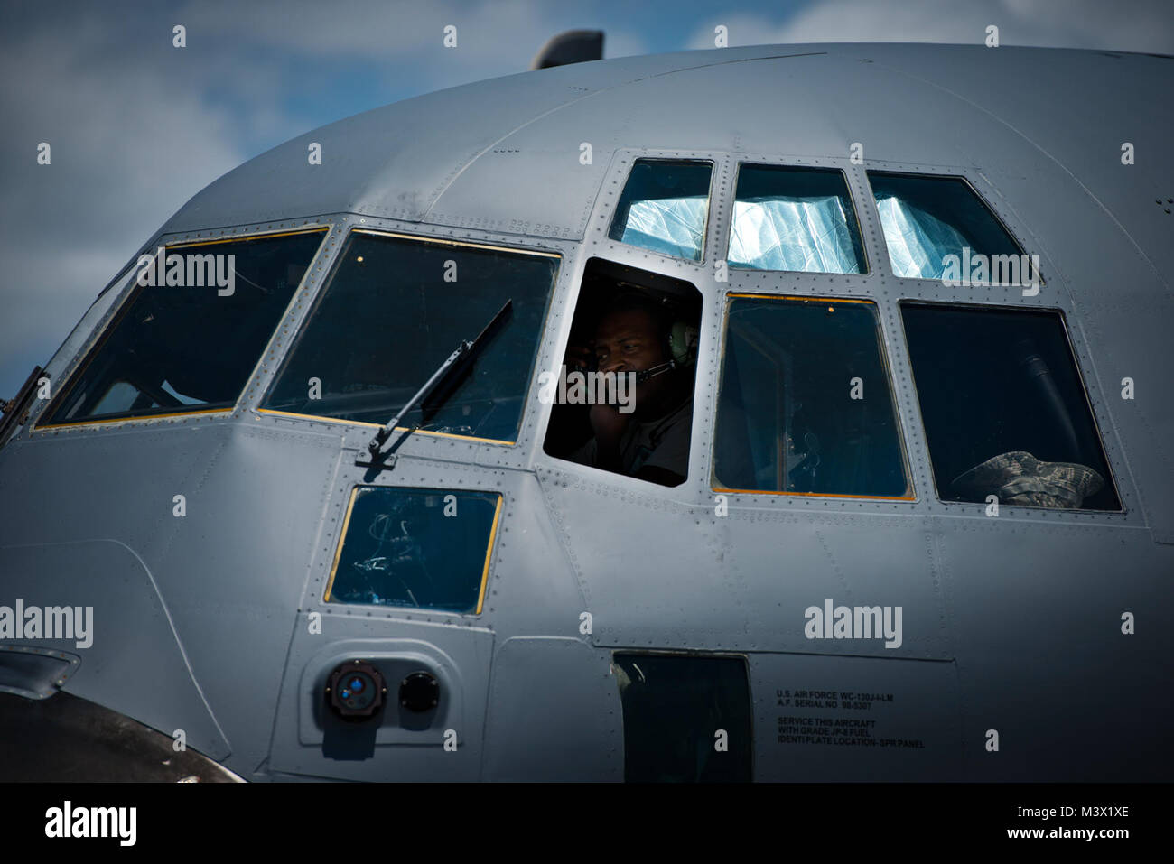 Master Sgt. Donald Maloid adjusts his headset before running the WC-130 ...