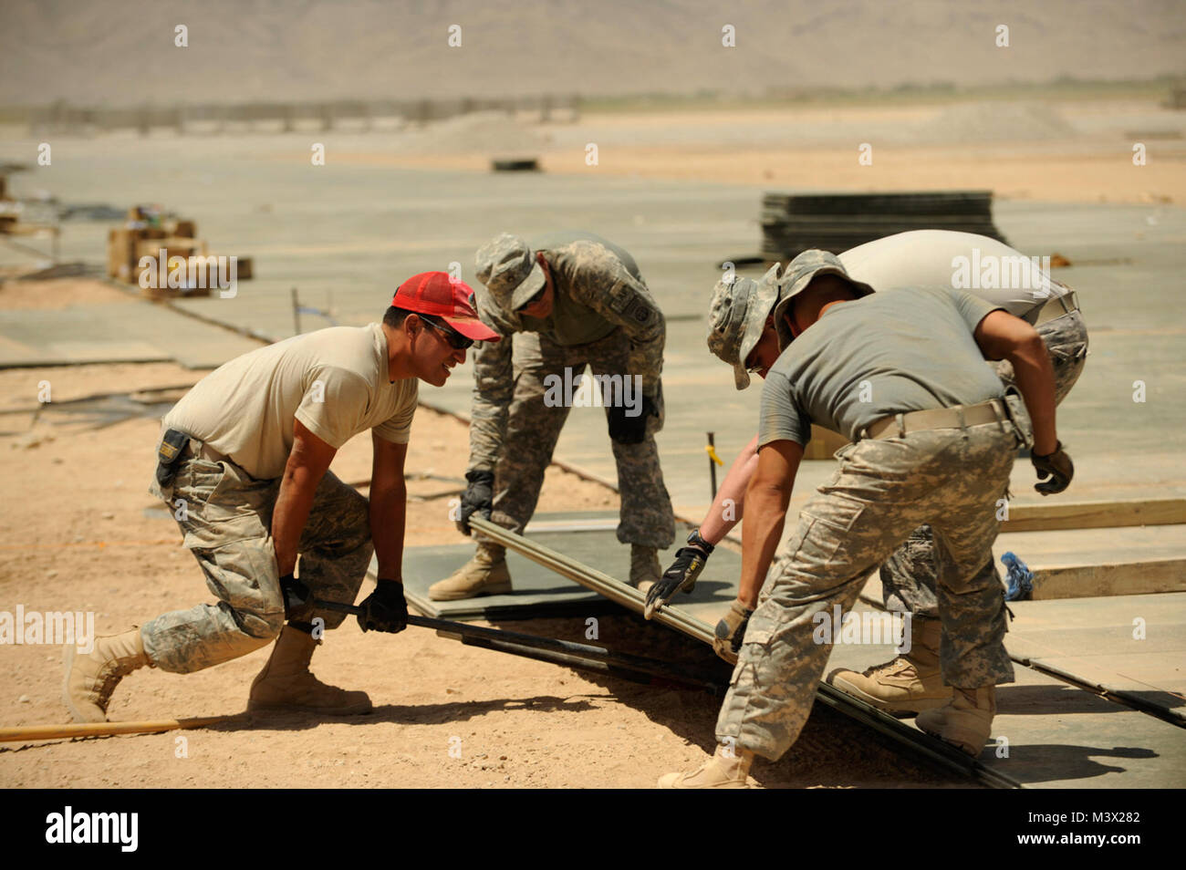U.S. Air Force Staff Sgt. Michael Zamora (left), civil engineer ...